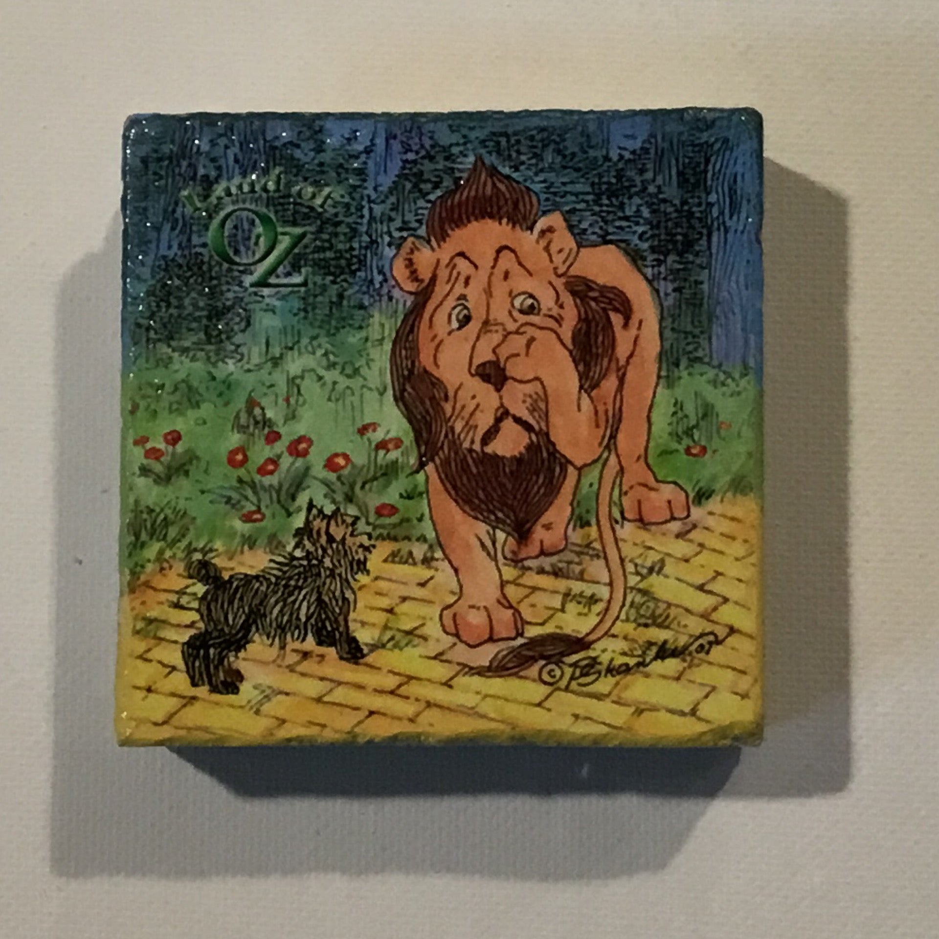 Crying Lion and Toto on Limestone Paperweight | Switchgrass